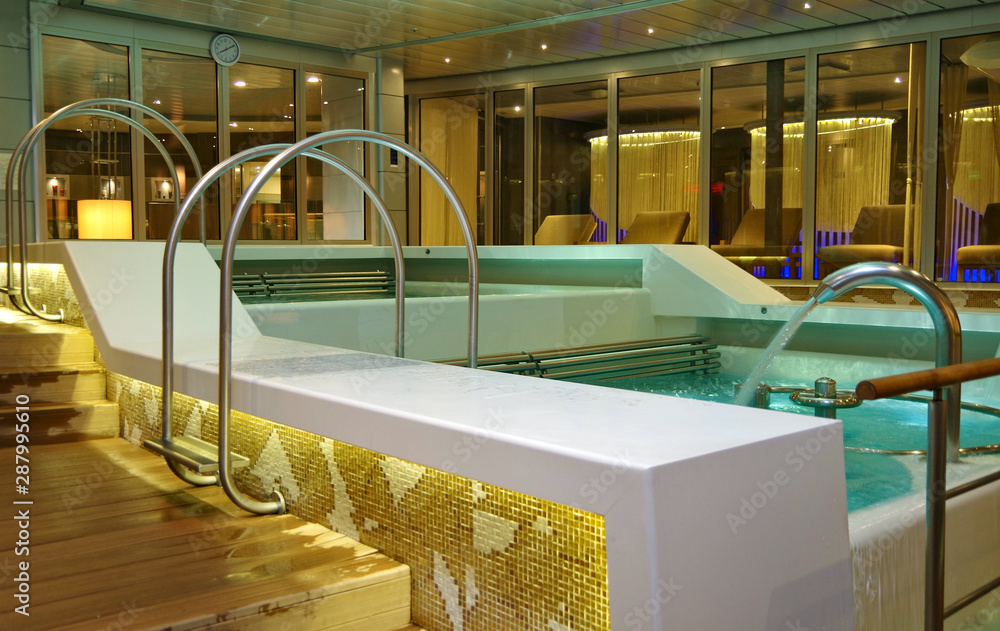 Indoor swimmingpool with hot tub whirlpool inside thermal suite in spa ...
