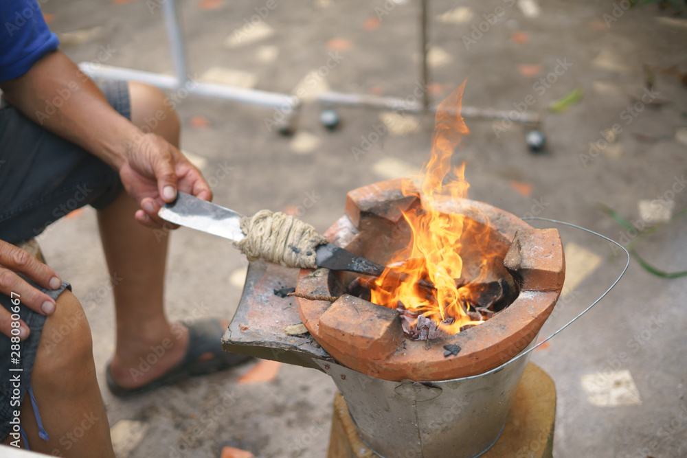 Blade handle fix and repair by Asian traditional method Stock Photo ...