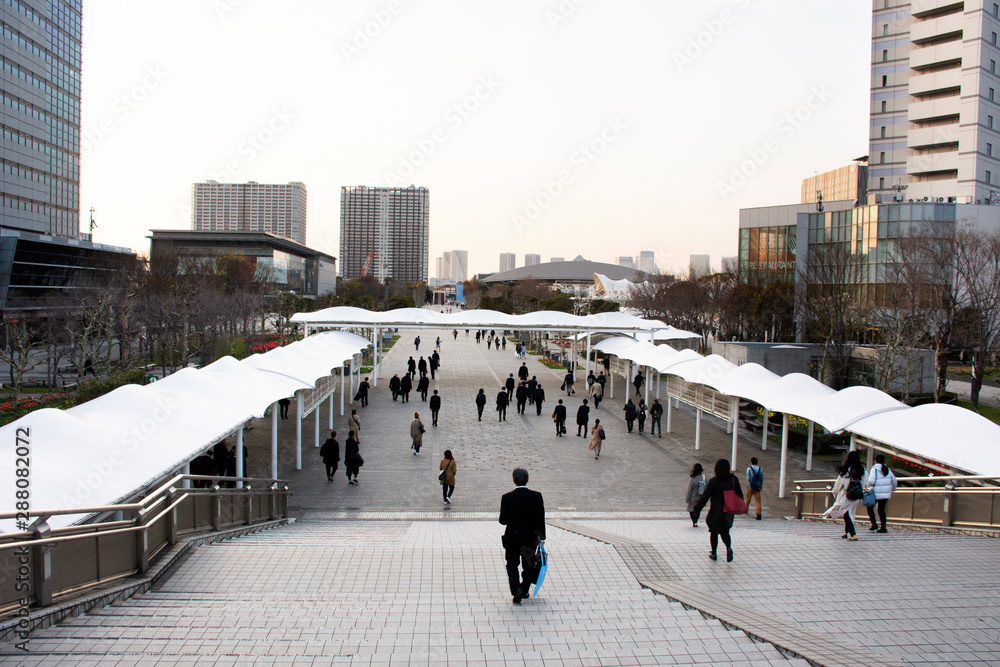 Japanese people and foreigners worker walking go to trains and bus ...
