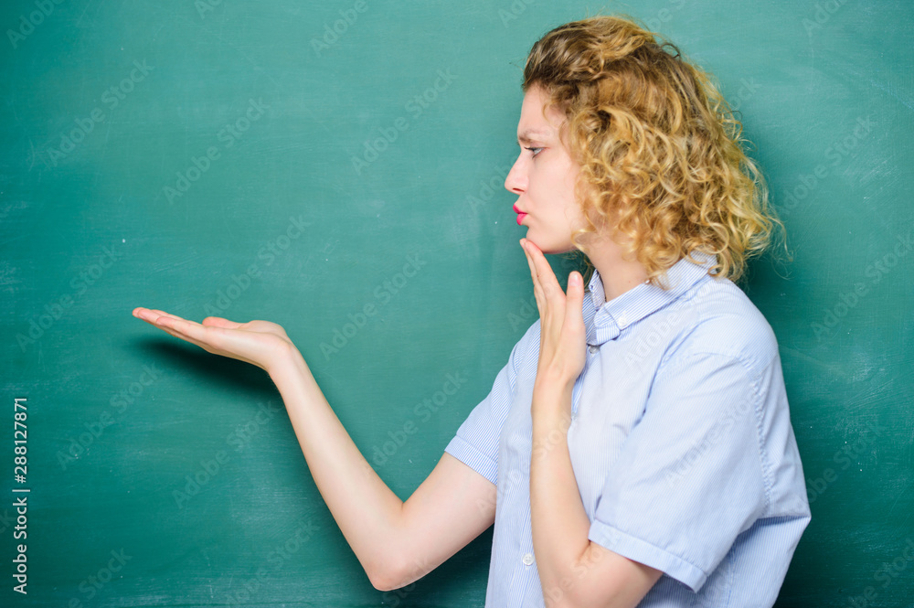 what is the answer. thoughtful student at blackboard. woman teacher at ...