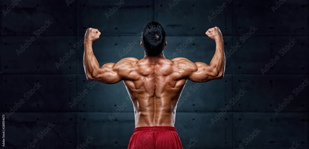 Muscular Men Flexing Musclles. Showing Back Muscles Development Stock ...
