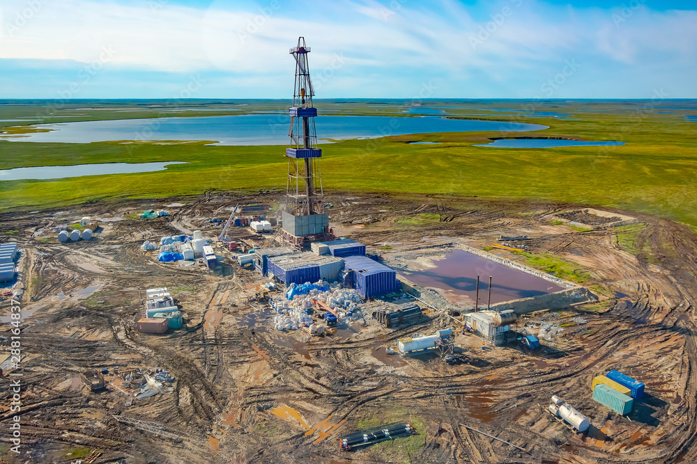 Drilling rig and equipment at an oil field in the northern tundra. Top ...