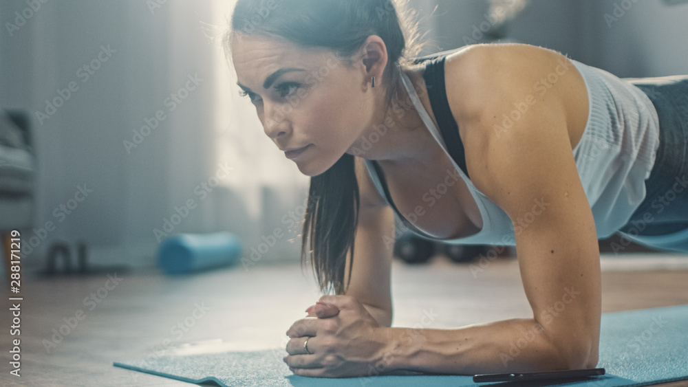 Strong Beautiful Fitness Girl in Athletic Workout Clothes is Doing a ...