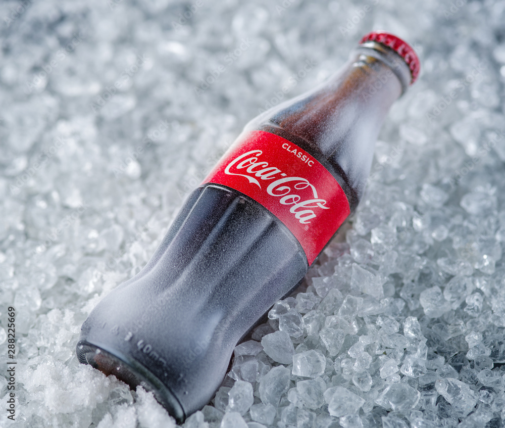 MINSK , BELARUS - MARCH 30 2019: Frozen Coca Cola Bottle in Ice. Coca ...
