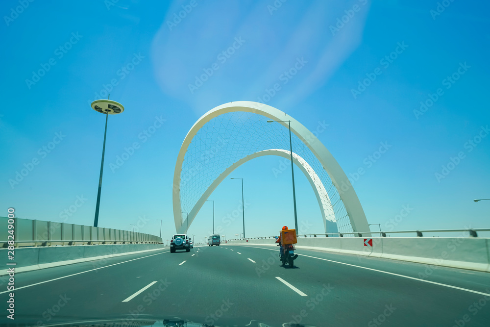 Lusail Expressway Memorial Arches crossing the highway interchange in ...