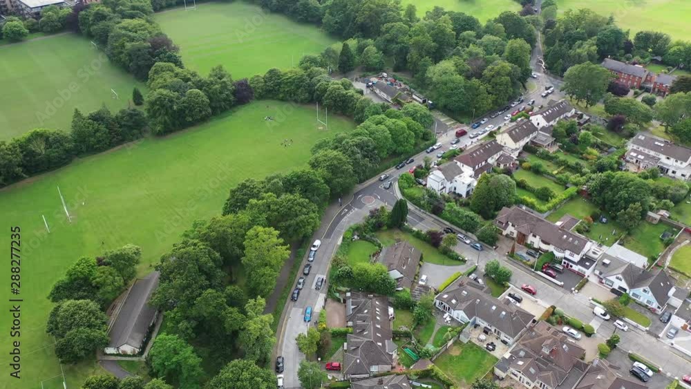 Drone flyover Irish suburban center and houses. Dublin bushy park ...