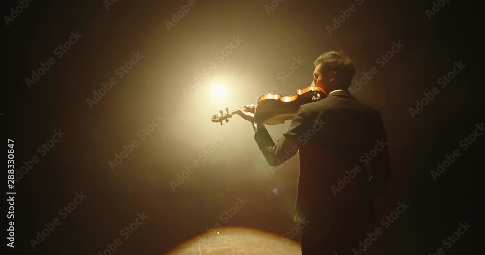 Male violin player having a solo on stage. Professional musician ...