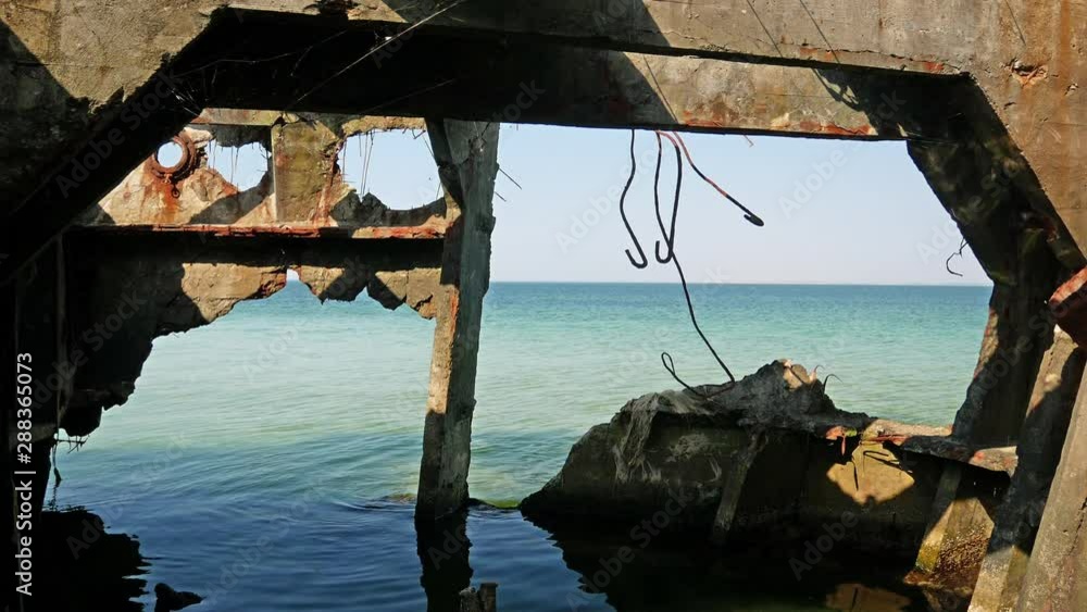 Inside an abandoned half-sunken shipwreck. A calm sea and a bright ...
