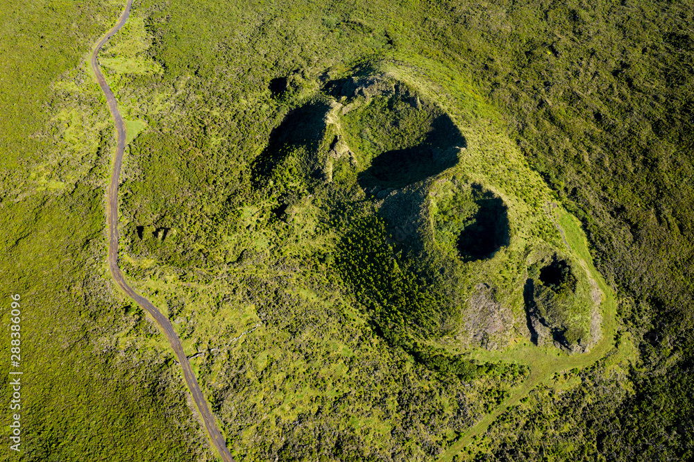 Aerial image of typical green volcanic caldera crater landscape with ...