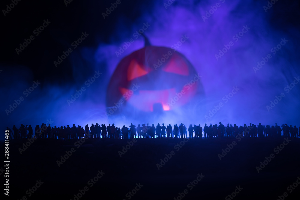 Blurred silhouette of giant monster prepare attack crowd during night ...