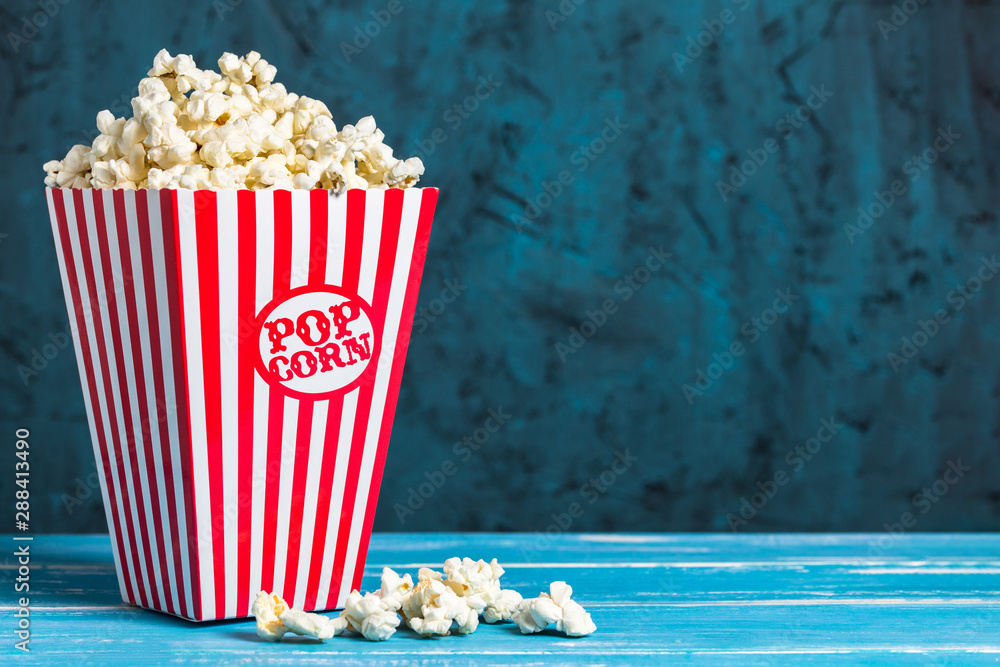Popcorn bucket on blue textured background with copy space Stock Photo ...