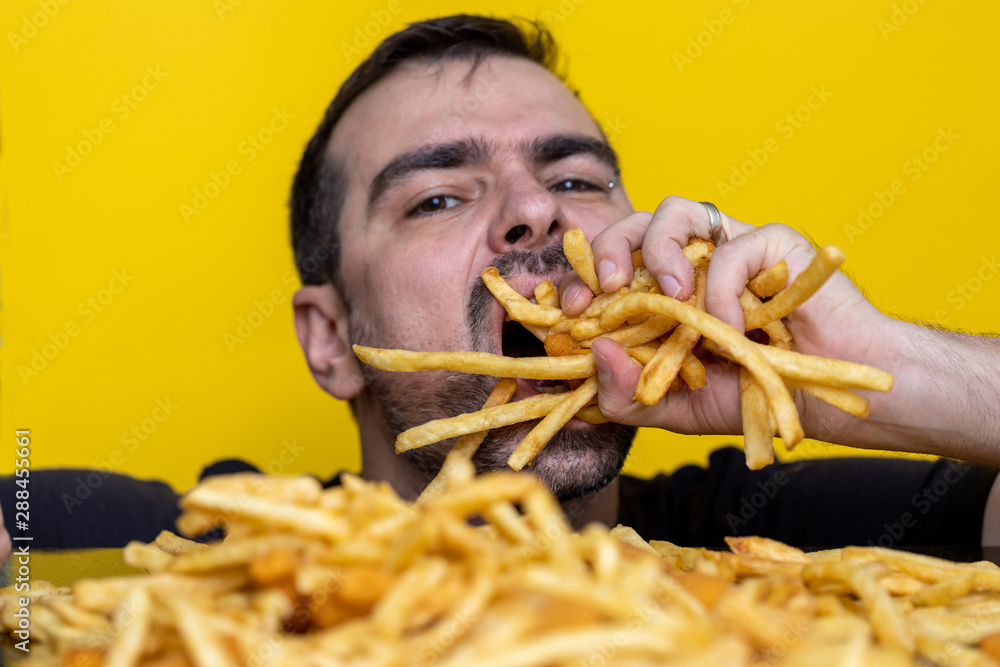 Eating junk food nutrition and dietary health problem concept. Young ...