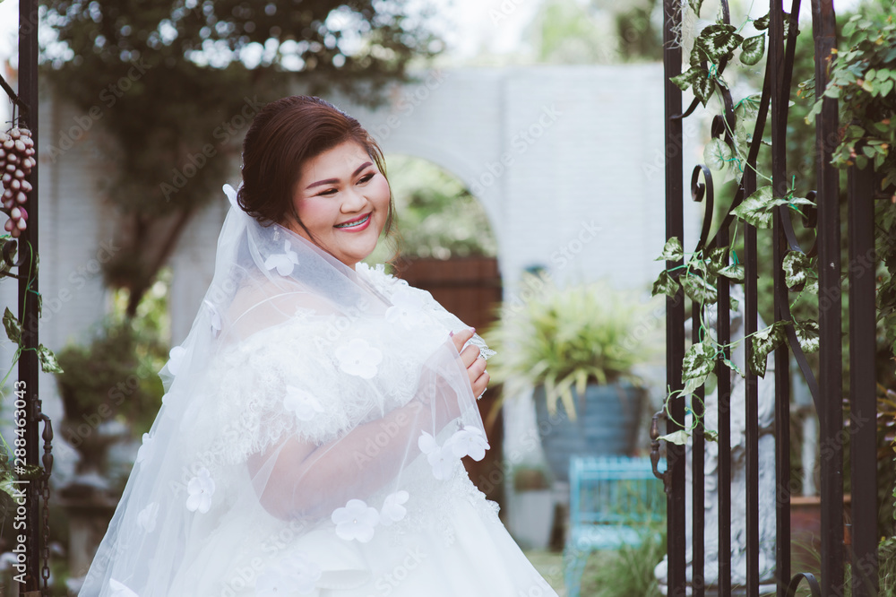 Happy overweight wedding dress and tuxedo or plus size newlywed bride ...