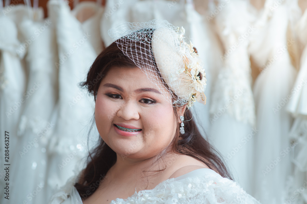 Happy overweight wedding dress and tuxedo or plus size newlywed or ...