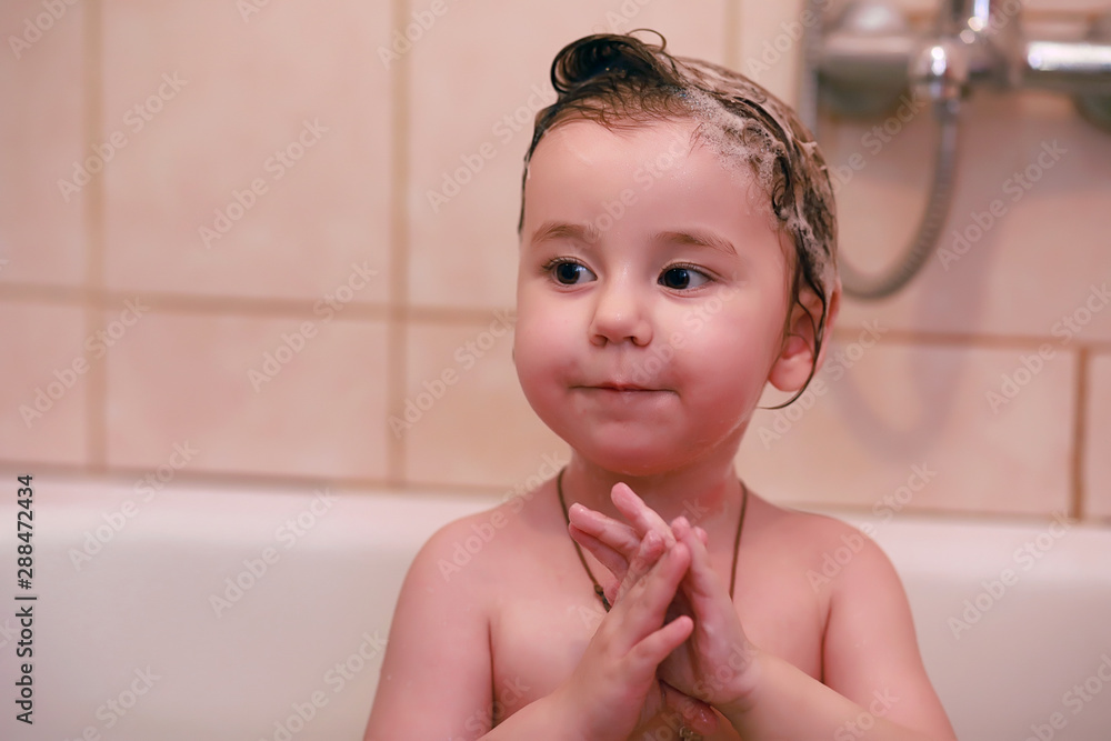 Young children take a bath. Children wash in the bathroom. Brother and ...