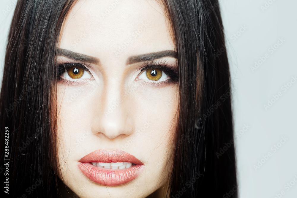 Beautiful girl. Portrait. Brunette with brown eyes. Face close up ...