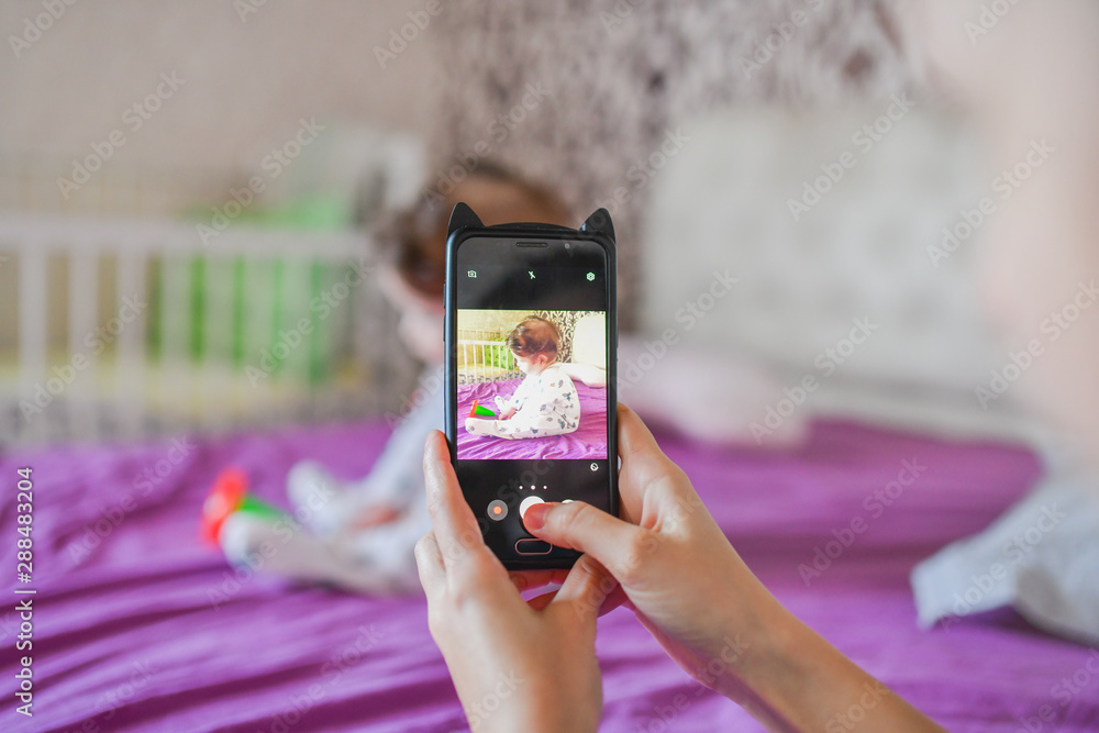 mom photographs the child, as a keepsake. Mother photographer ...