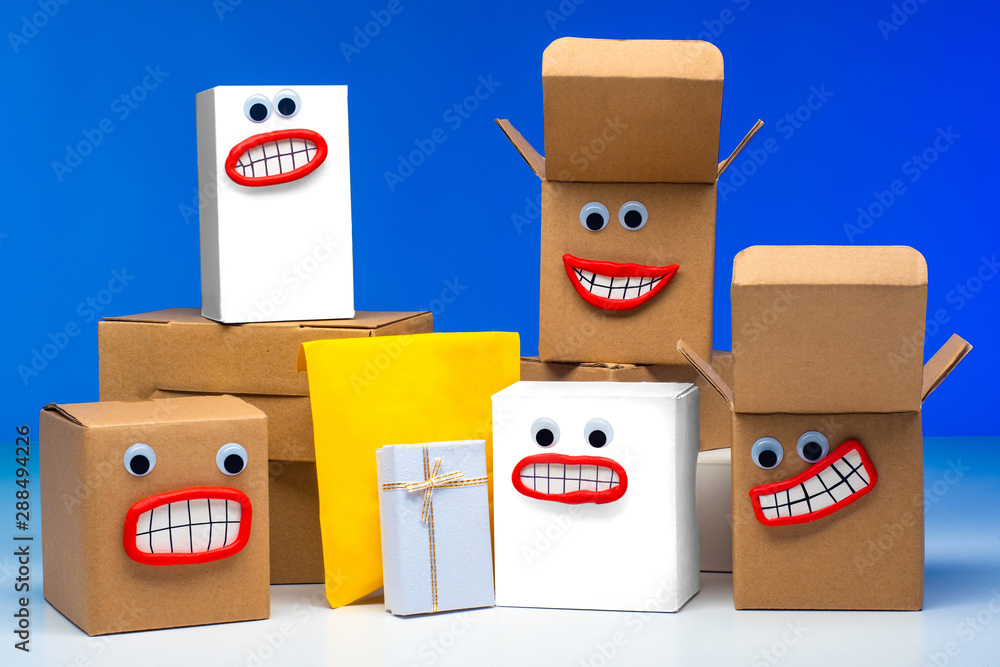 Emodji boxes. Many different cardboard boxes with eyes and mouths ...