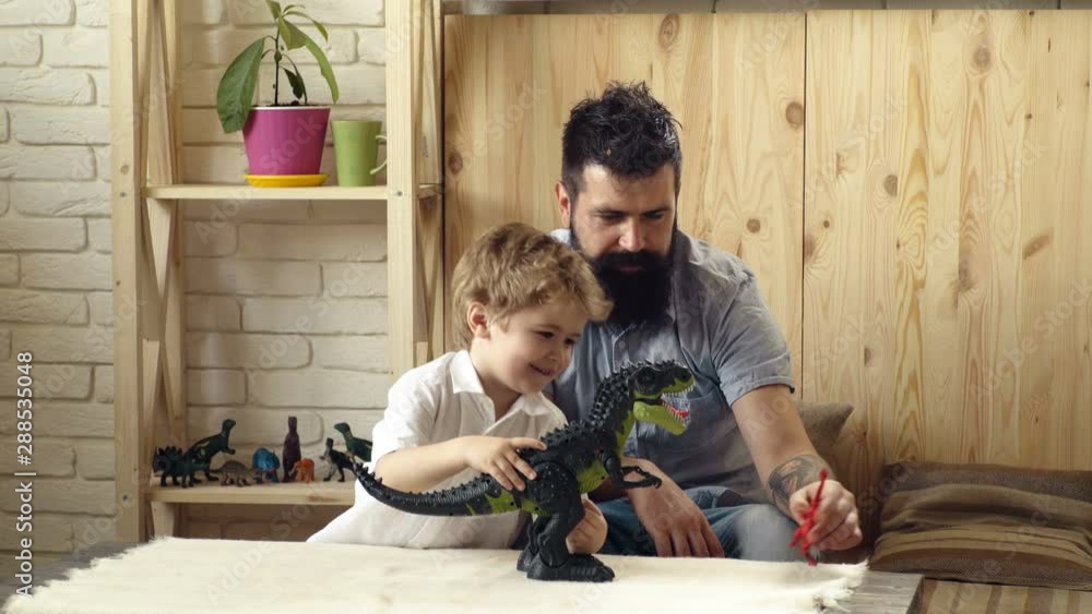 Father has fun with his son. An exemplary father and a boy at leisure ...