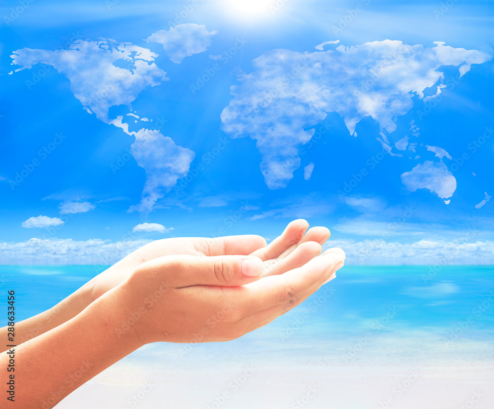Hands of man praying over world map of clouds and sea background Stock ...