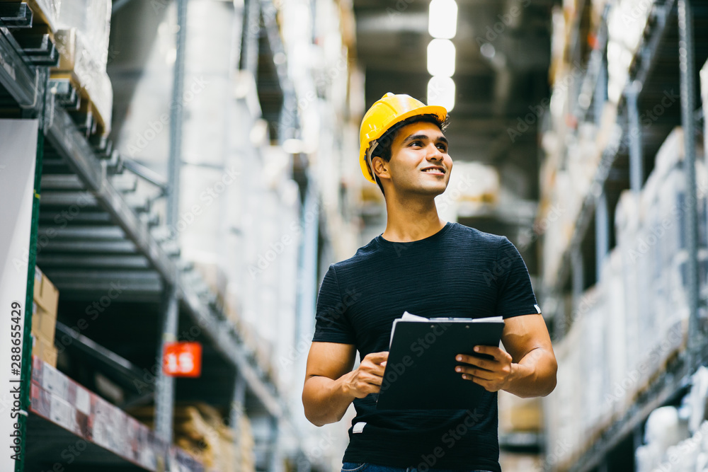 Smart Indian engineer man worker wearing safety helmet doing ...