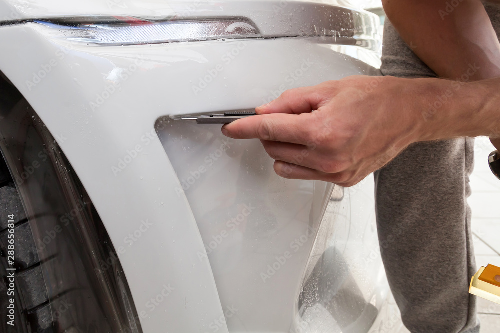 Retrofitting the car with a solid transparent protective film, the ...