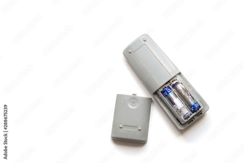 Remote control with old battery leak on white background. Hazardous ...