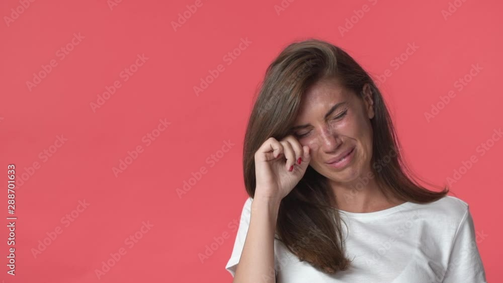 Adult woman crying her heart out feeling let down and upset, wipe tears ...