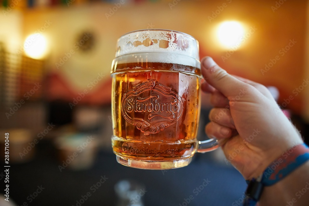 BRNO, CZECH REPUBLIC - JUNE 17, 2019: Holding a big glass of Starobrno ...