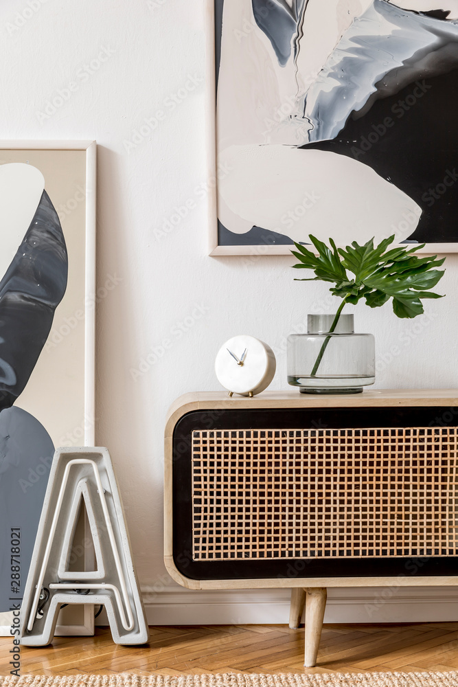 Stylish interior design of living room with modern commode, abstract ...