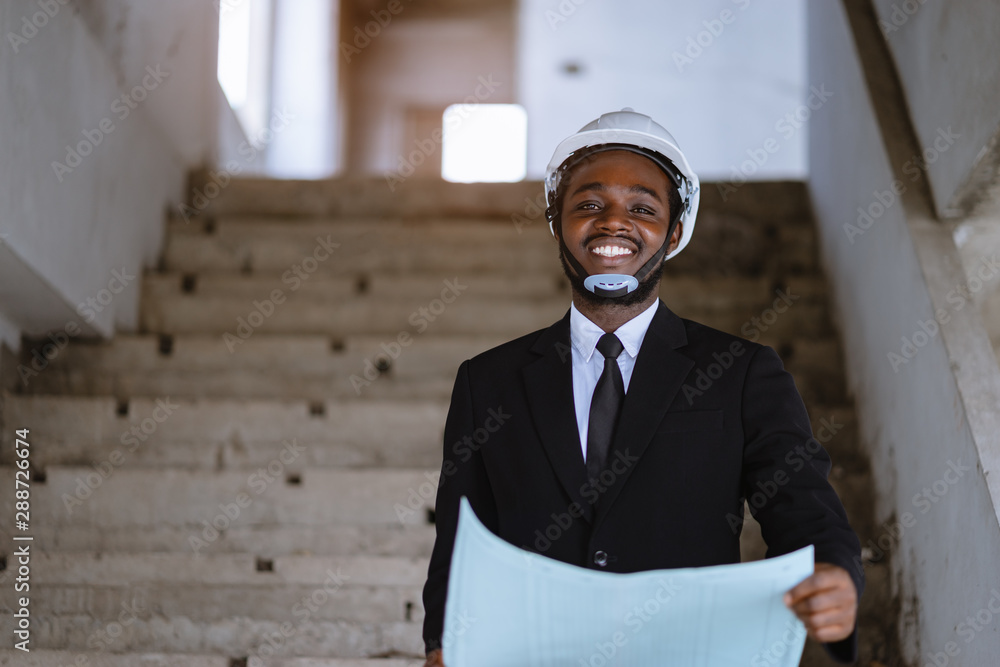 Engineer african man smiling with a big natural laughing at unfinished ...