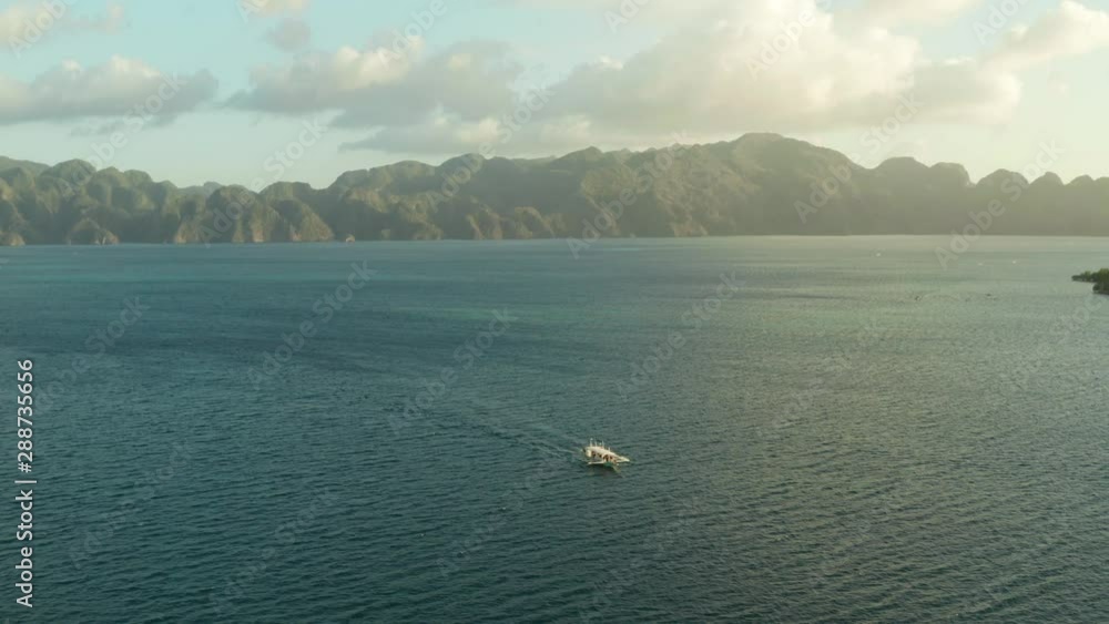 Aerial view seascape bay with islands and mountains sunset. tour boat ...