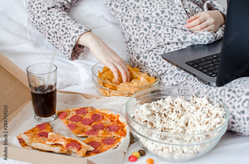 Beautiful young woman eating unhealthy food Stock Photo | Adobe Stock