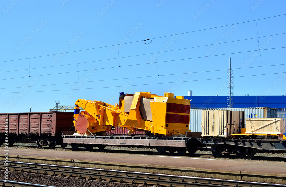 Logistics transportation heavy mining dump truck by rail. Yellow mining ...