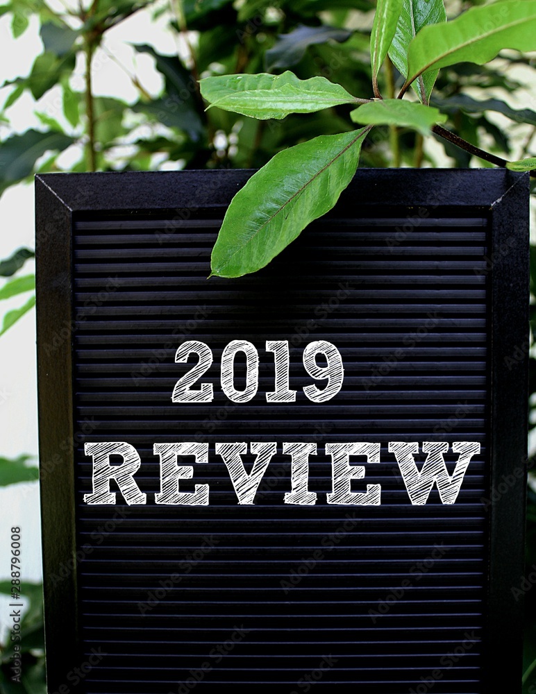 2019 Review concept - Isolated text on black background with colorful ...