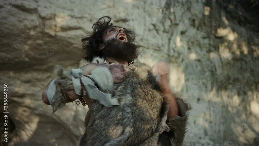 Portrait of Primeval Caveman Wearing Animal Skin Does Aggressive Chest ...
