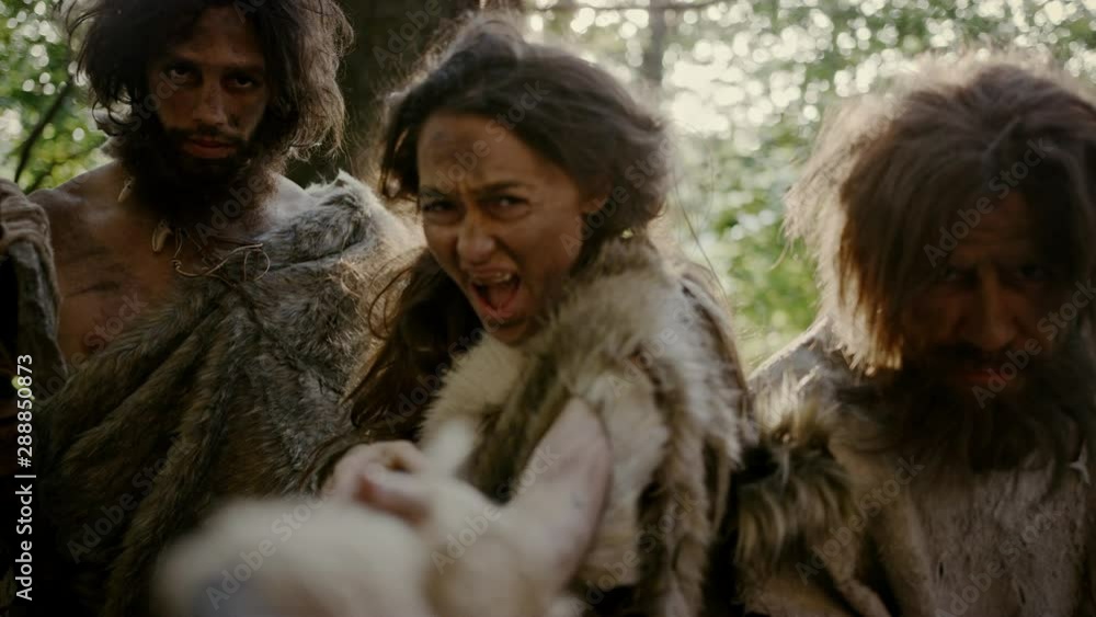 Vídeo do Stock: Female Leader and Two Primeval Cavemen Wearing Animal ...