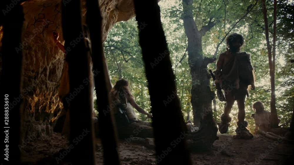 Tribe of Hunter-Gatherers Wearing Animal Skin Live in a Cave. Men ...