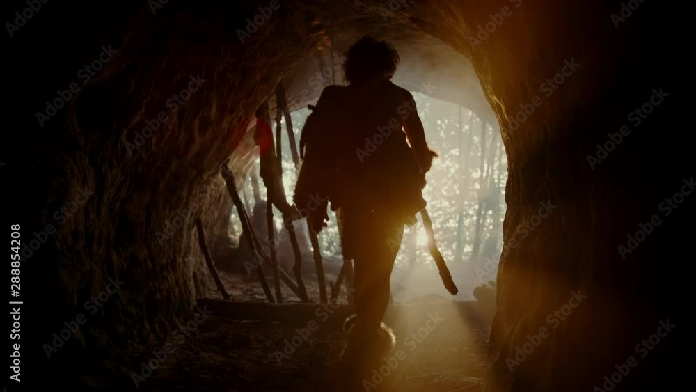 Tribe of Hunter-Gatherers Wearing Animal Skin Live in a Cave. Leader ...