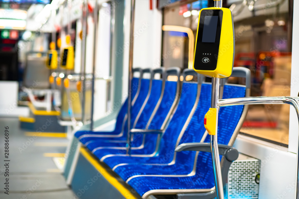 Public transport. Bus inside view. Places for passengers. Handrails on ...