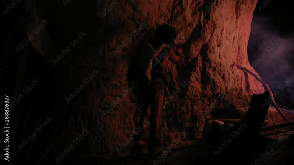 Primitive Prehistoric Neanderthal Wearing Animal Skin Draws Animals and ...