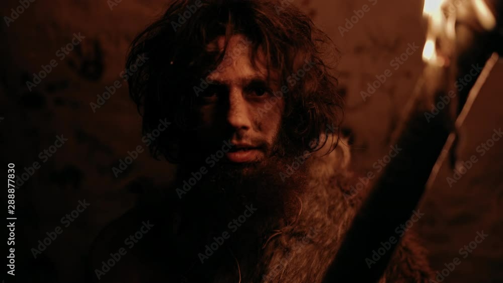 Portrait of Primeval Caveman Wearing Animal Skin Standing in His Cave ...