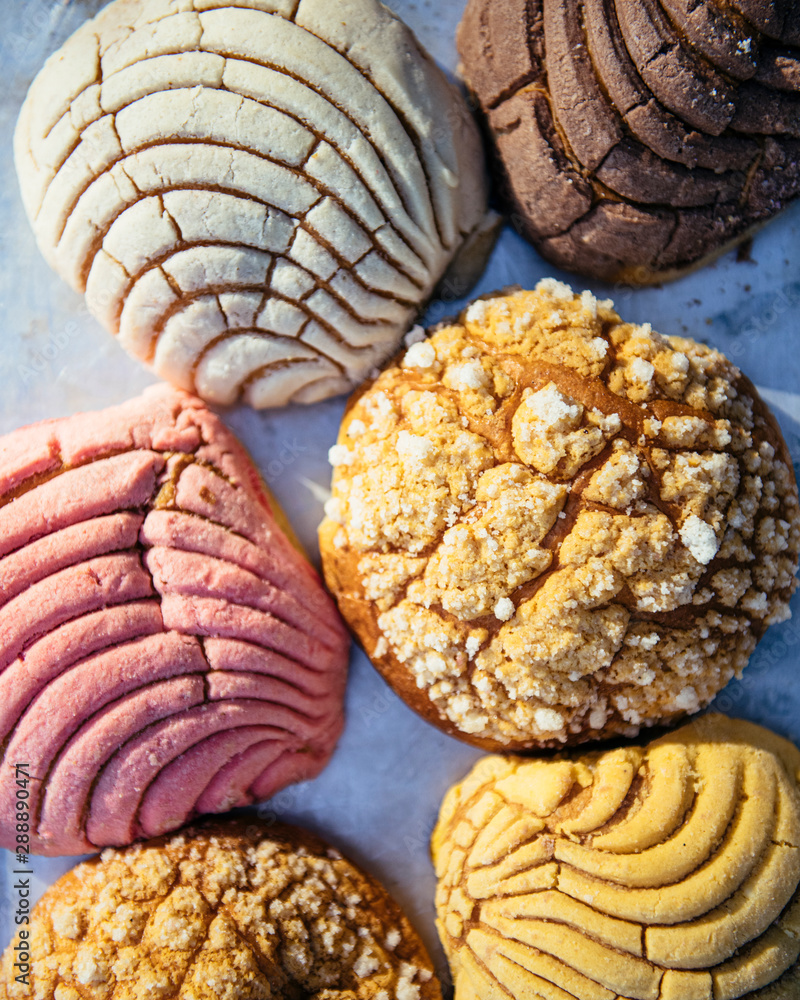 Multicolored Conchas on Sheet Pan Stock Photo | Adobe Stock