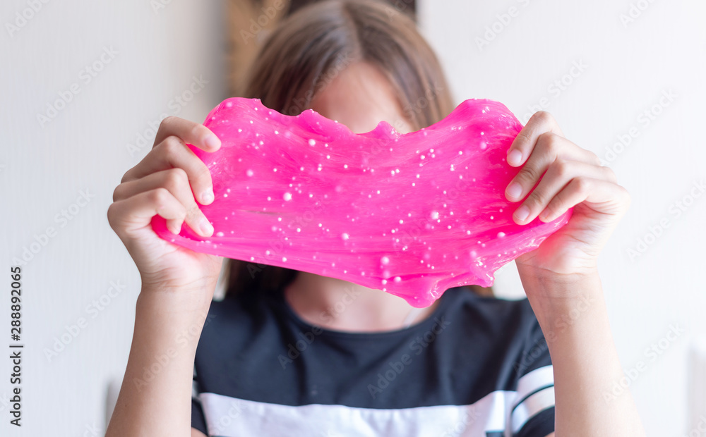 girl playing with slime. selective focus. Stock Photo | Adobe Stock