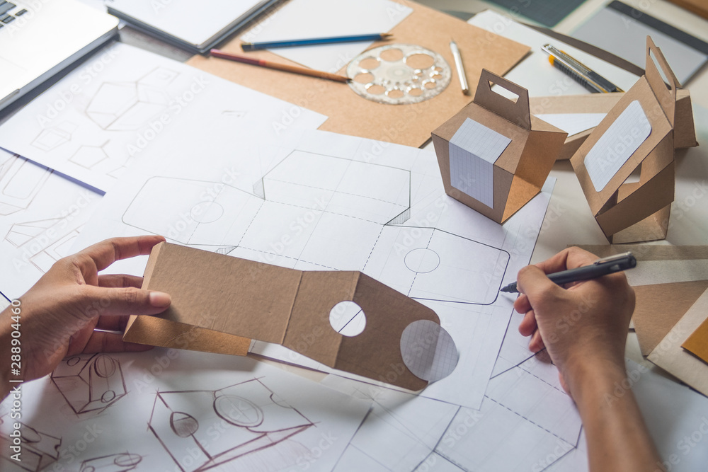 Designer sketching drawing design Brown craft cardboard paper product ...