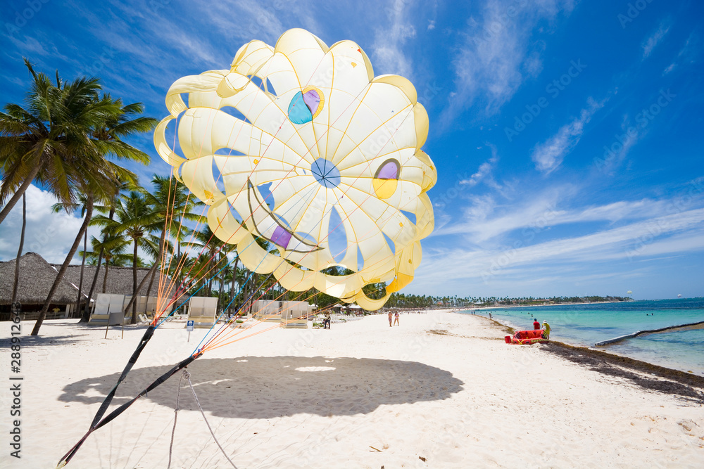 Colorful parasail wing over sandy beach of Sargasso Sea, Punta Cana ...