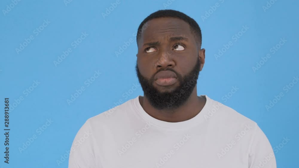 Closeup portrait of a young angry unhappy stressed man looking up away ...