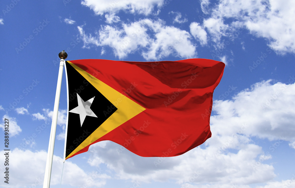 East Timor flag template floating under the blue sky. Country in ...