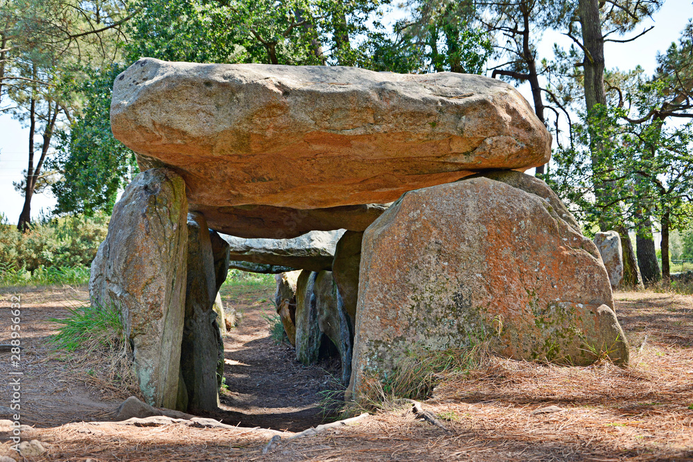 Prehistoric dolmen near megalithic menhirs alignment. Carnac, Brittany ...