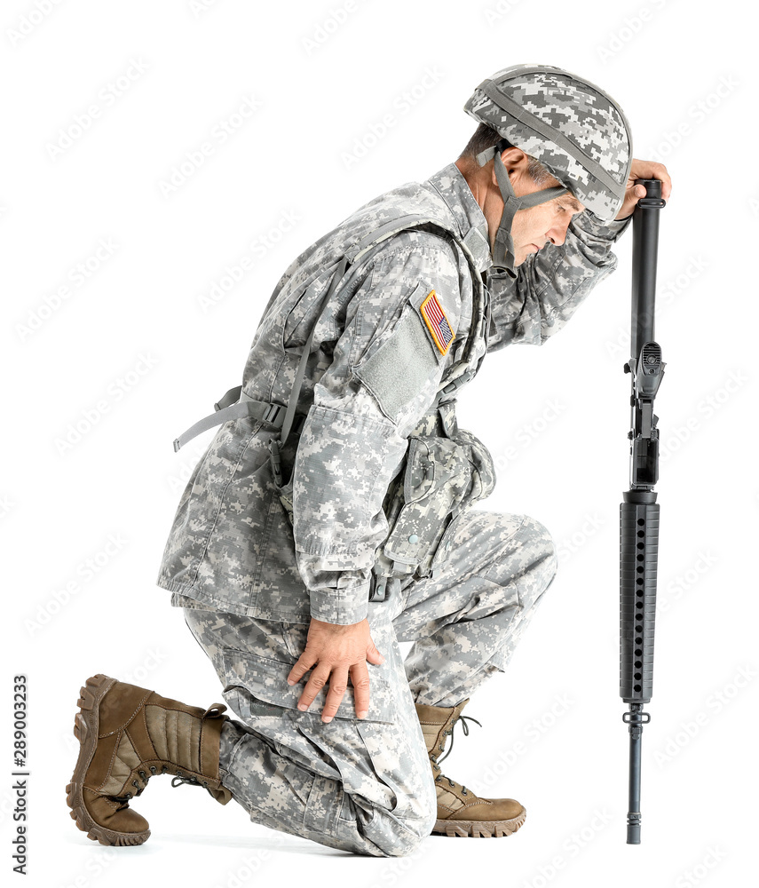 Mature male soldier mourning for his dead comrade on white background ...